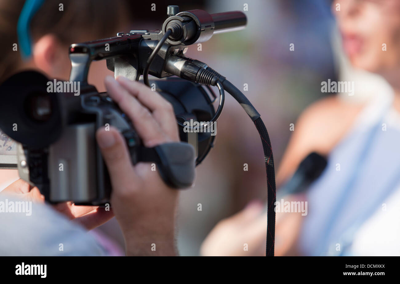 journalist hand holding a microphone conducting an TV or radio ...