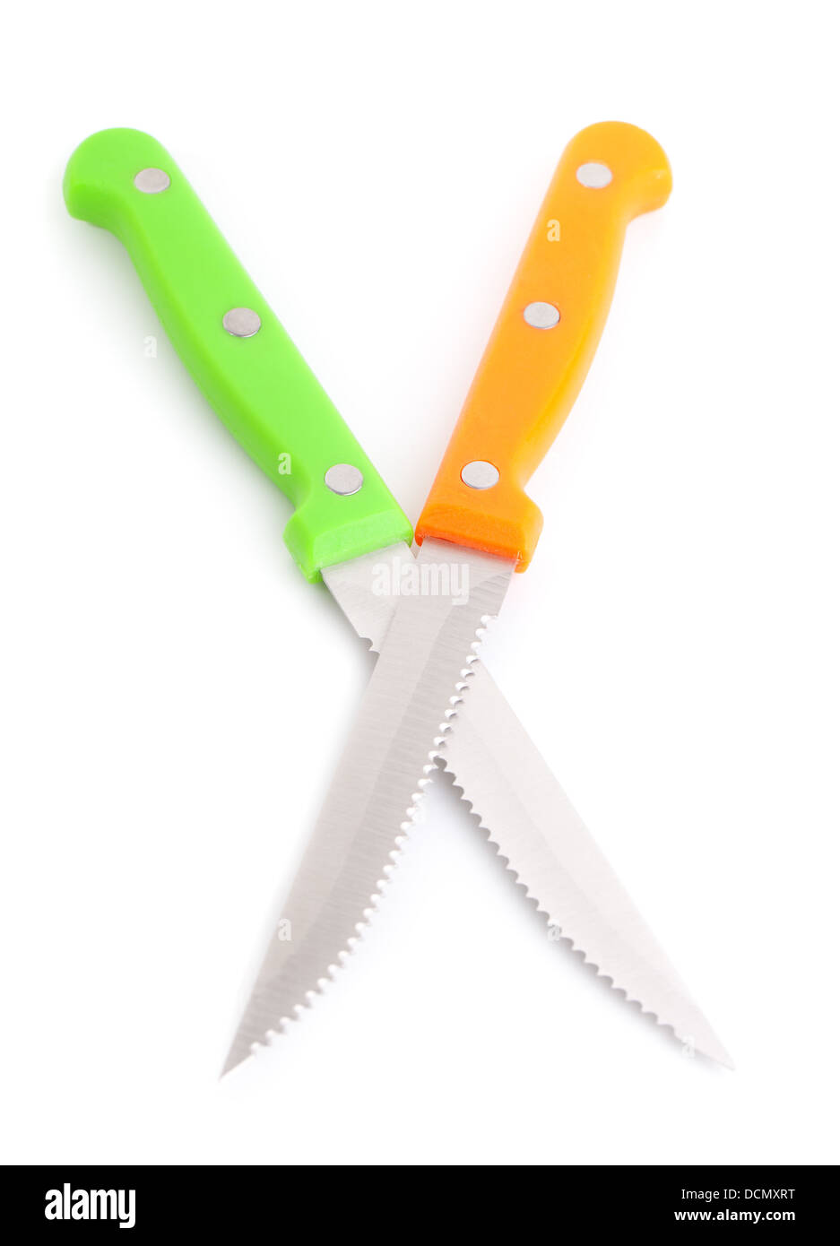 Two color crossed knifes isolated on a white background Stock Photo - Alamy