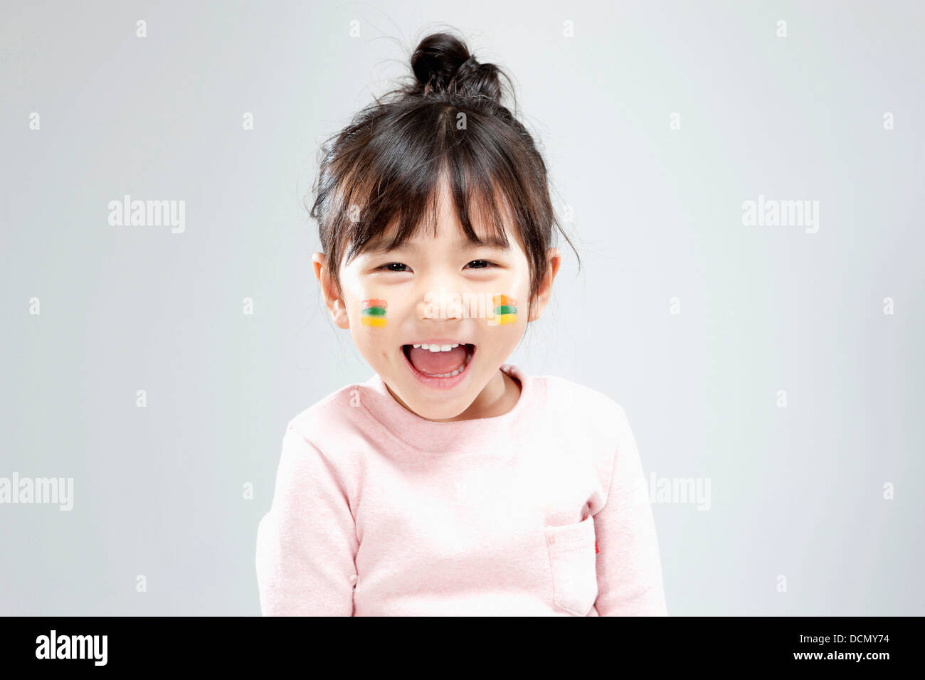 close up of a girl with face paint laughing Stock Photo - Alamy