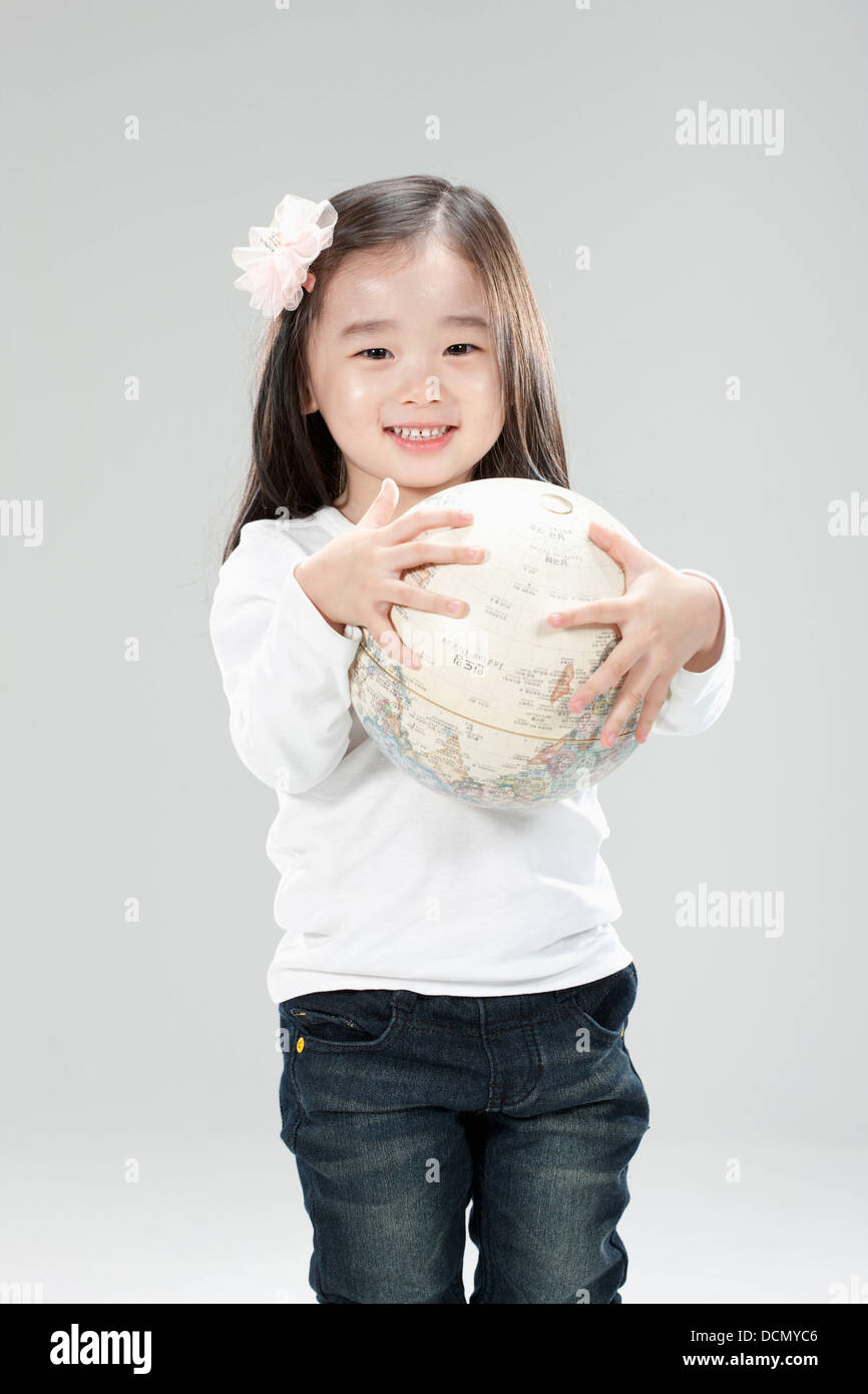 a girl hugging a globe Stock Photo - Alamy