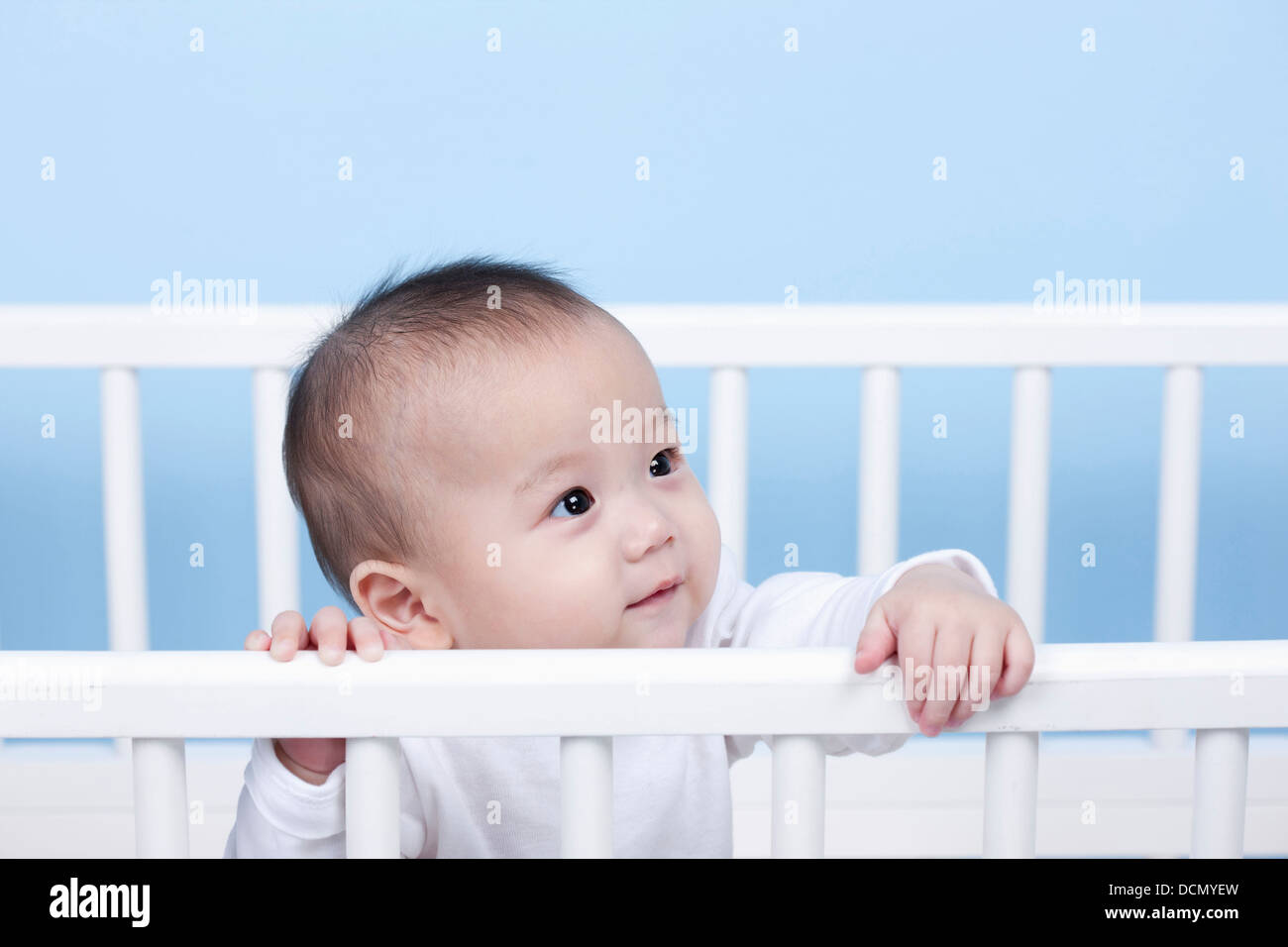 a baby inside a crib Stock Photo - Alamy