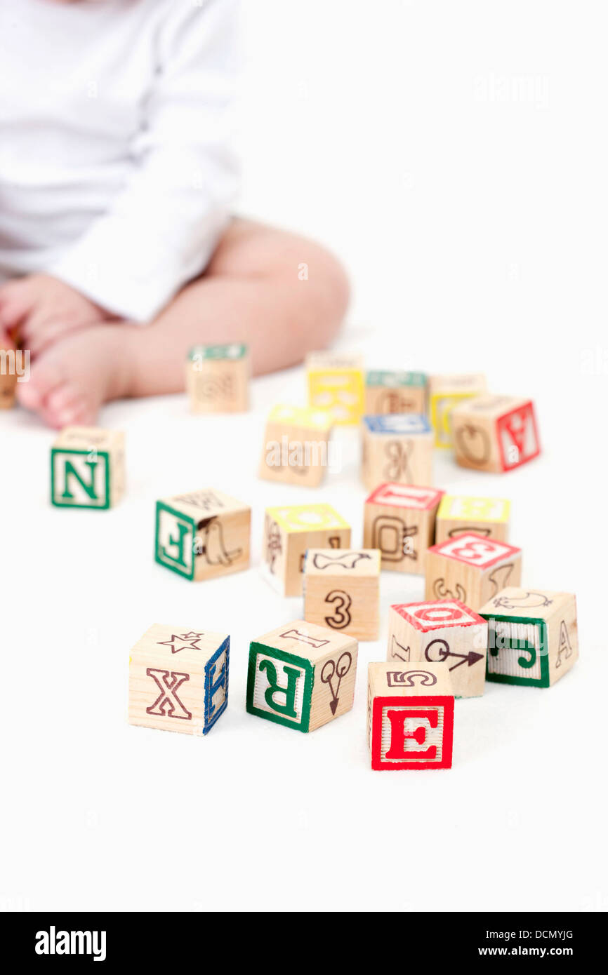 a baby playing with blocks Stock Photo - Alamy