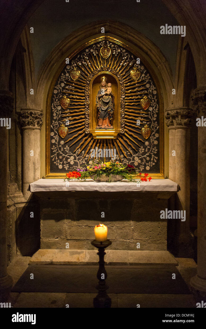 Candle in front of altar in catholic church hi-res stock photography ...