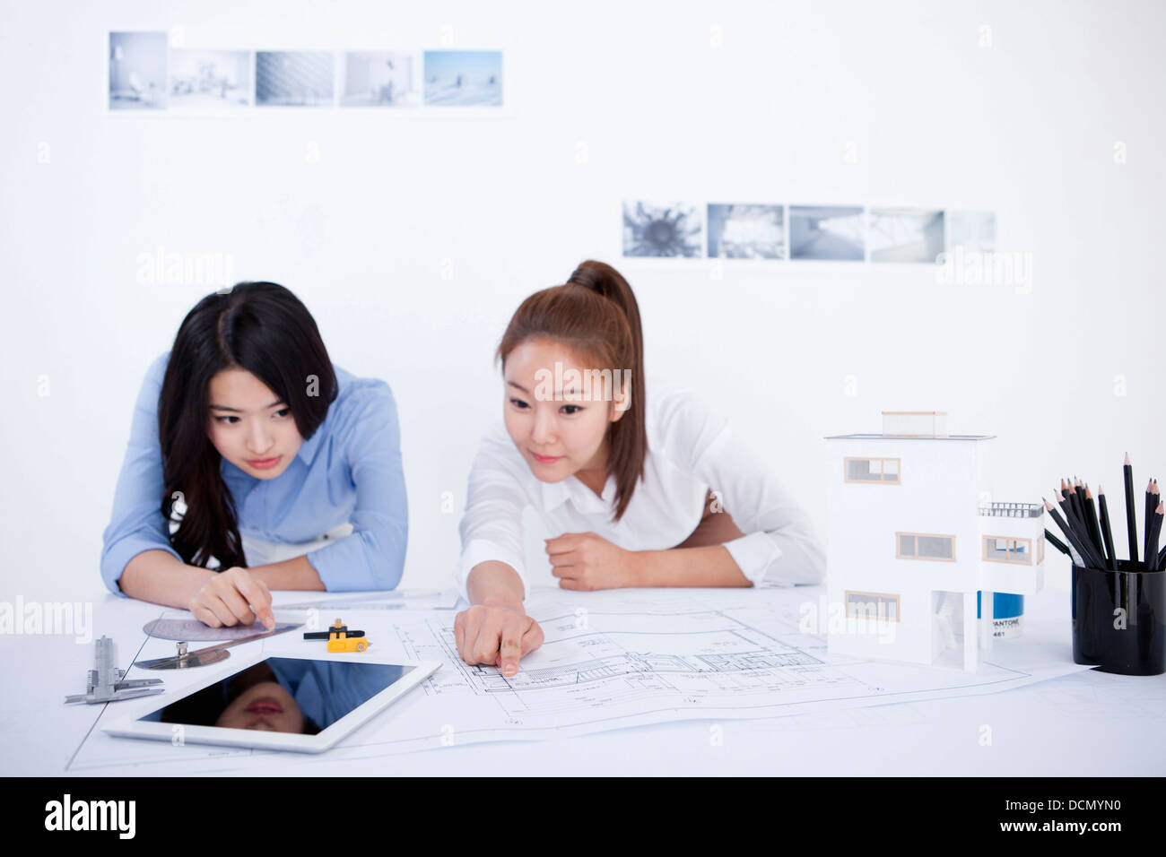 two interior designers working on a project Stock Photo - Alamy