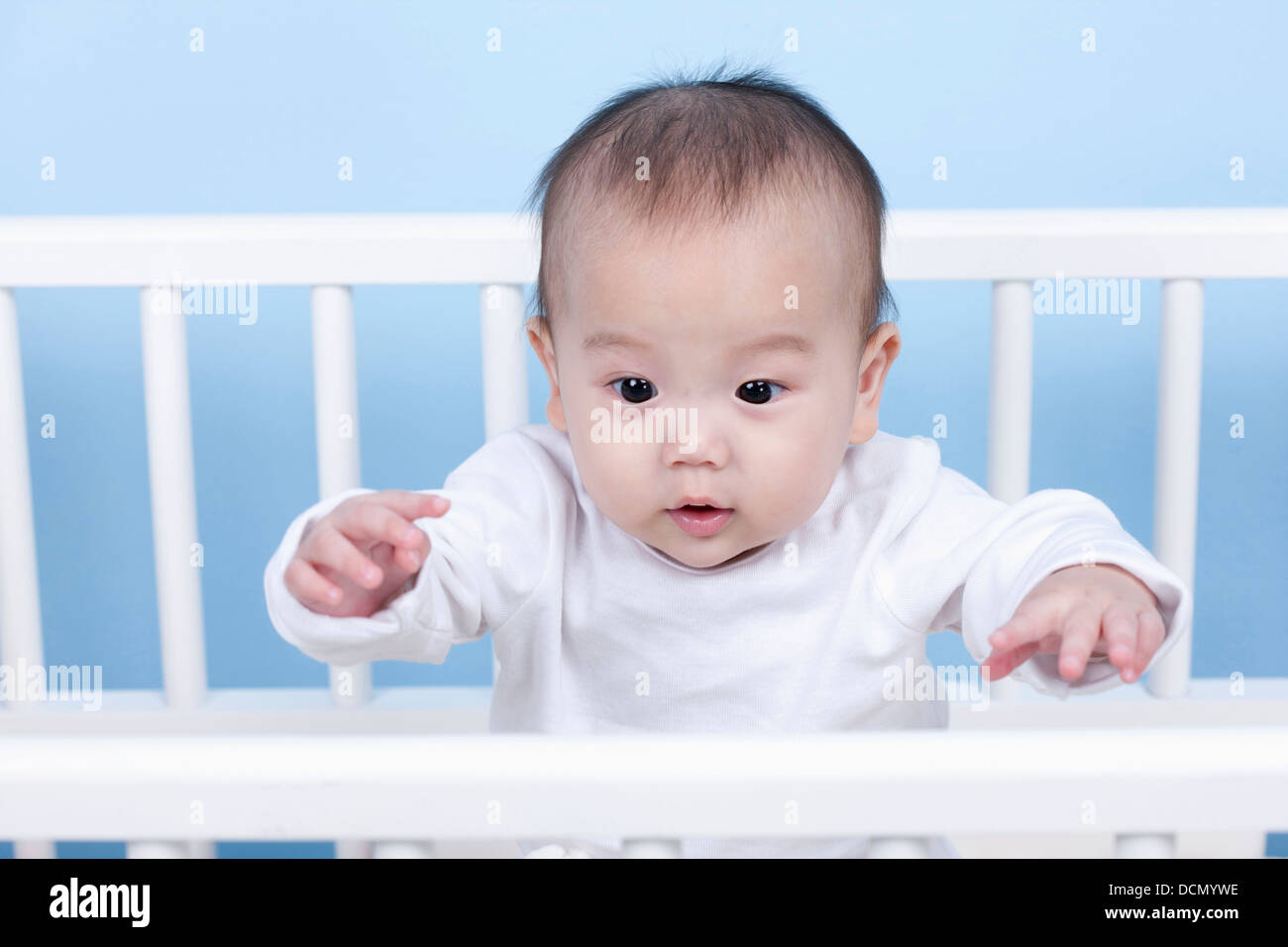 a baby inside a crib Stock Photo - Alamy