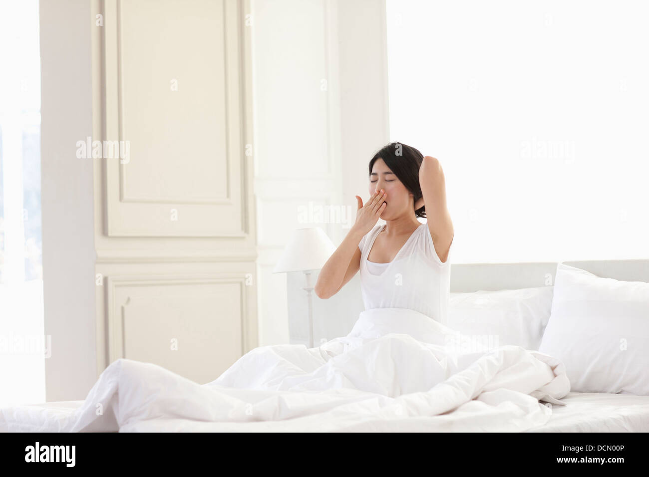 a woman waking up from sleep Stock Photo - Alamy
