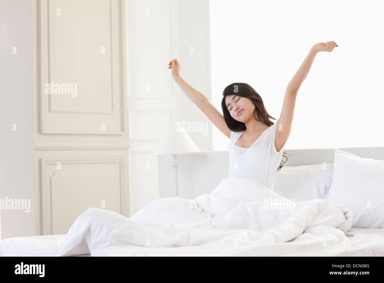 a woman waking up from sleep Stock Photo - Alamy