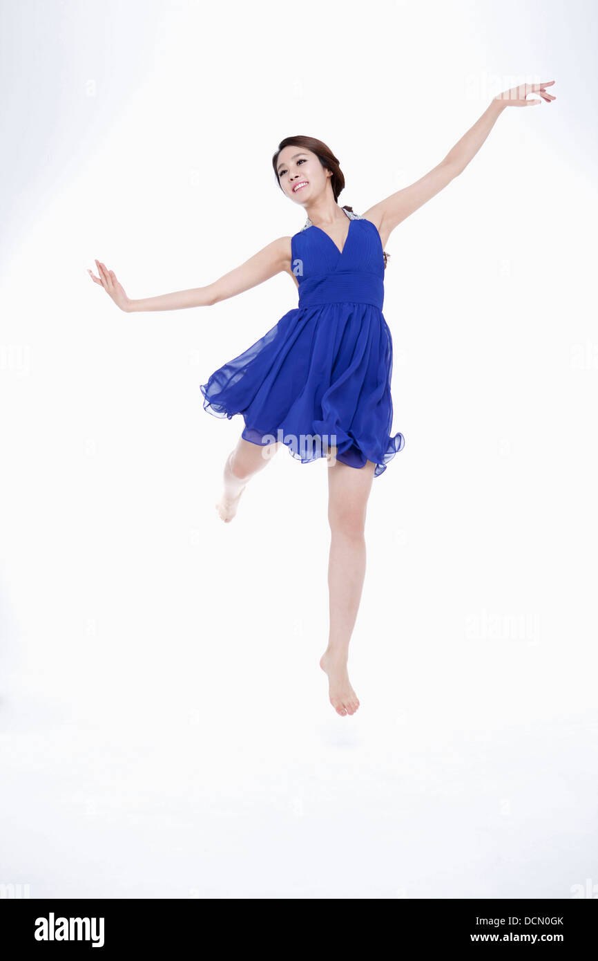 a woman in blue fancy dress posing like a ballerina Stock Photo - Alamy