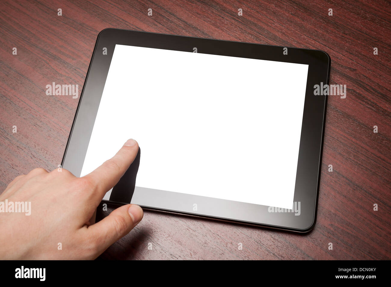 empty tablet on the brown table desk. Copy space Stock Photo - Alamy