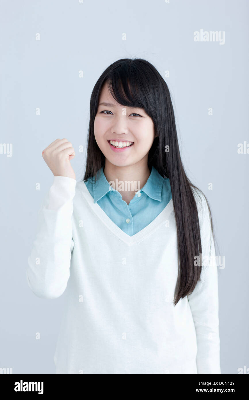 a lady with cheering pose Stock Photo - Alamy