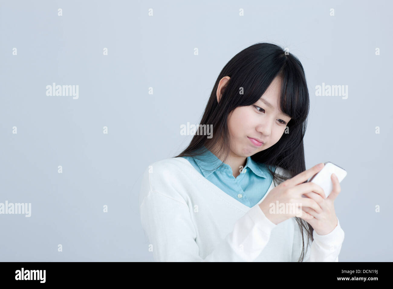 a lady using a mobile phone Stock Photo - Alamy