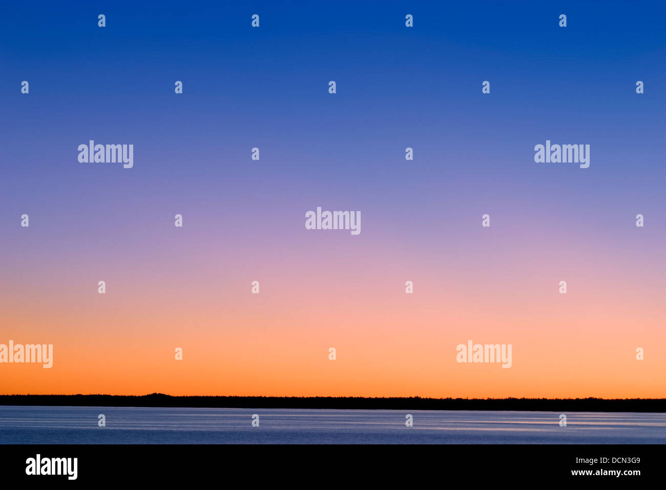 A Blazing And Colorful Sunset Sky Background Towering Over Lake ...