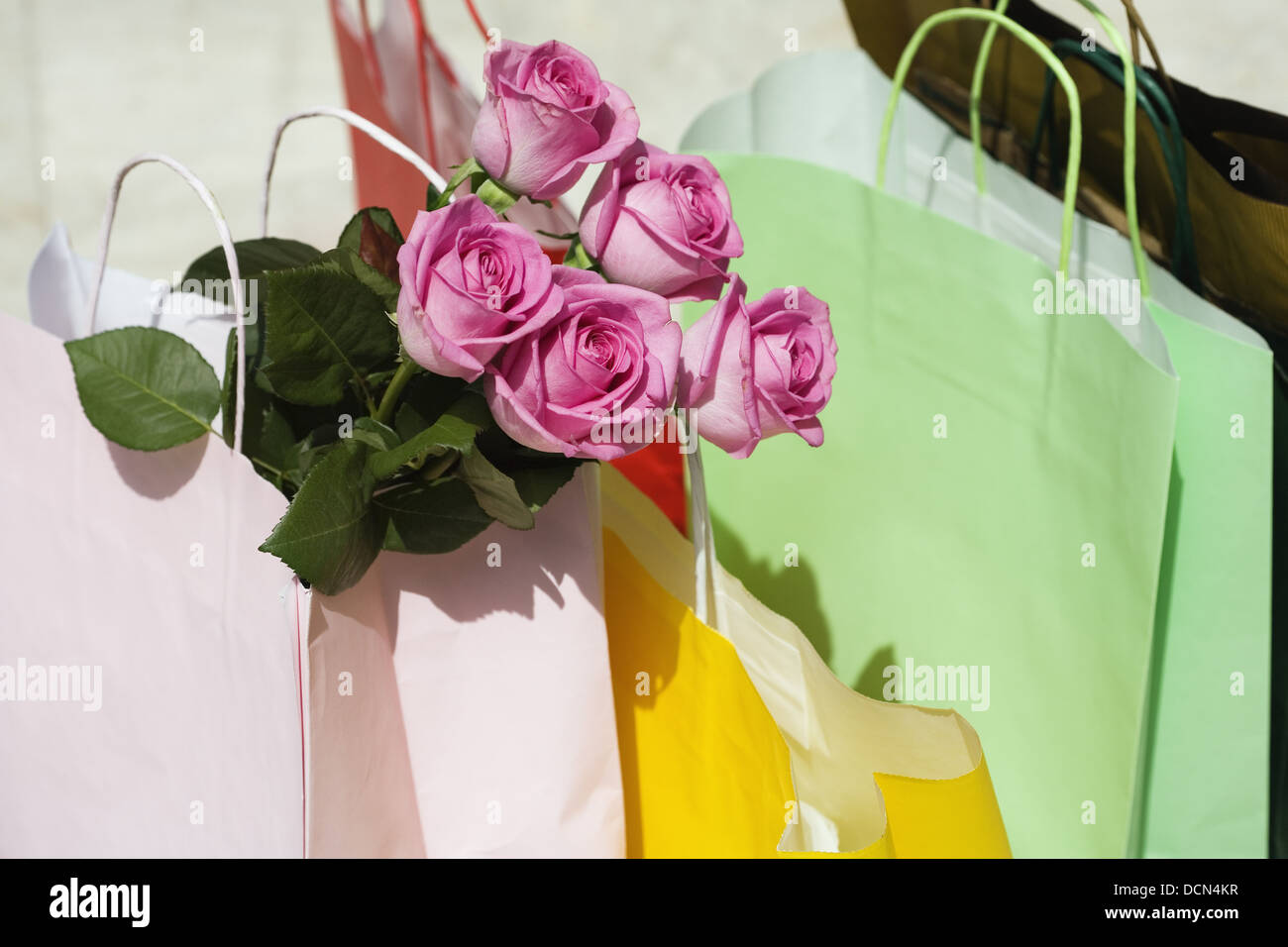 Shopping bags and roses Stock Photo - Alamy