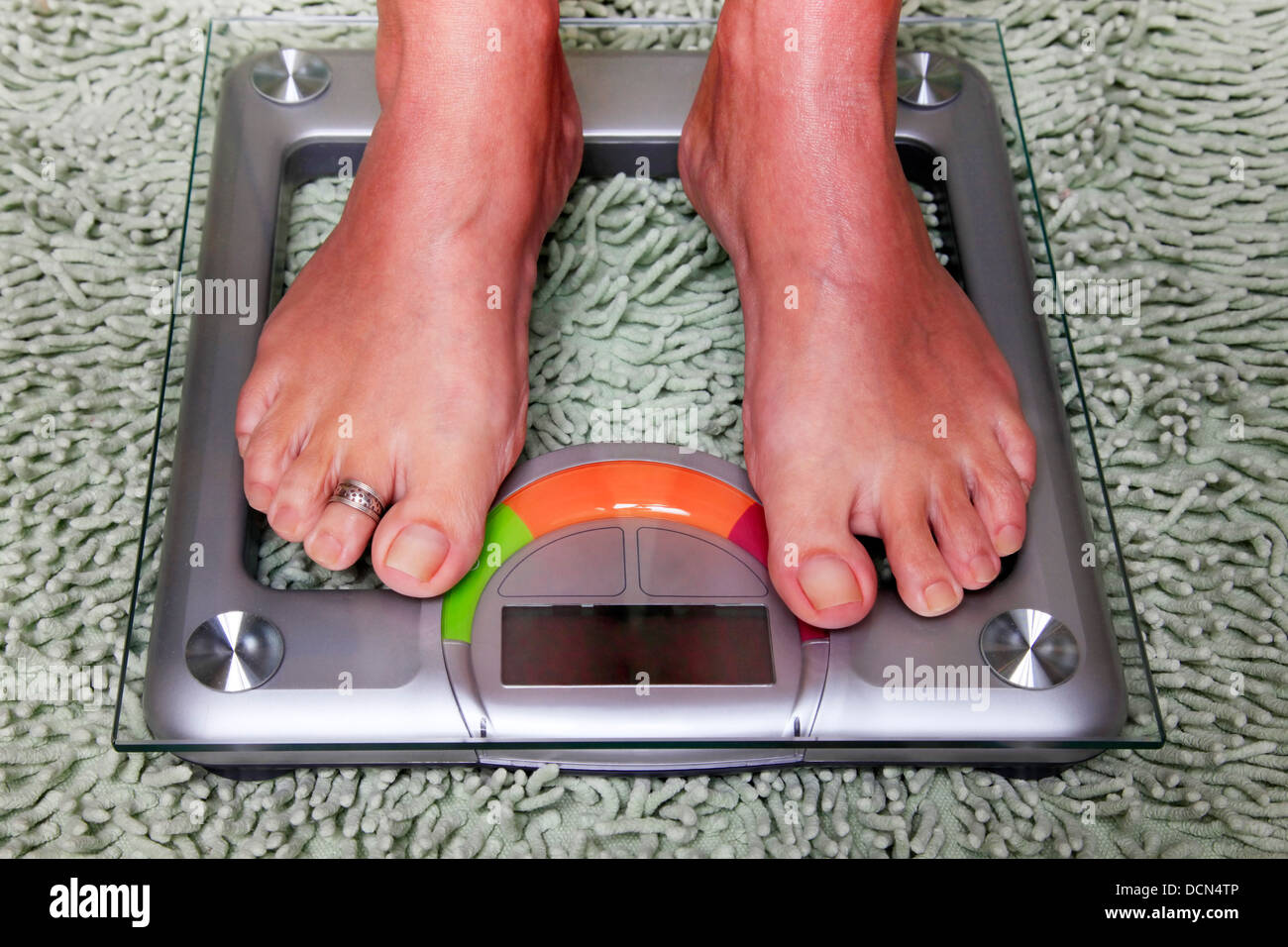 Person standing on scale jeans hi-res stock photography and images - Alamy