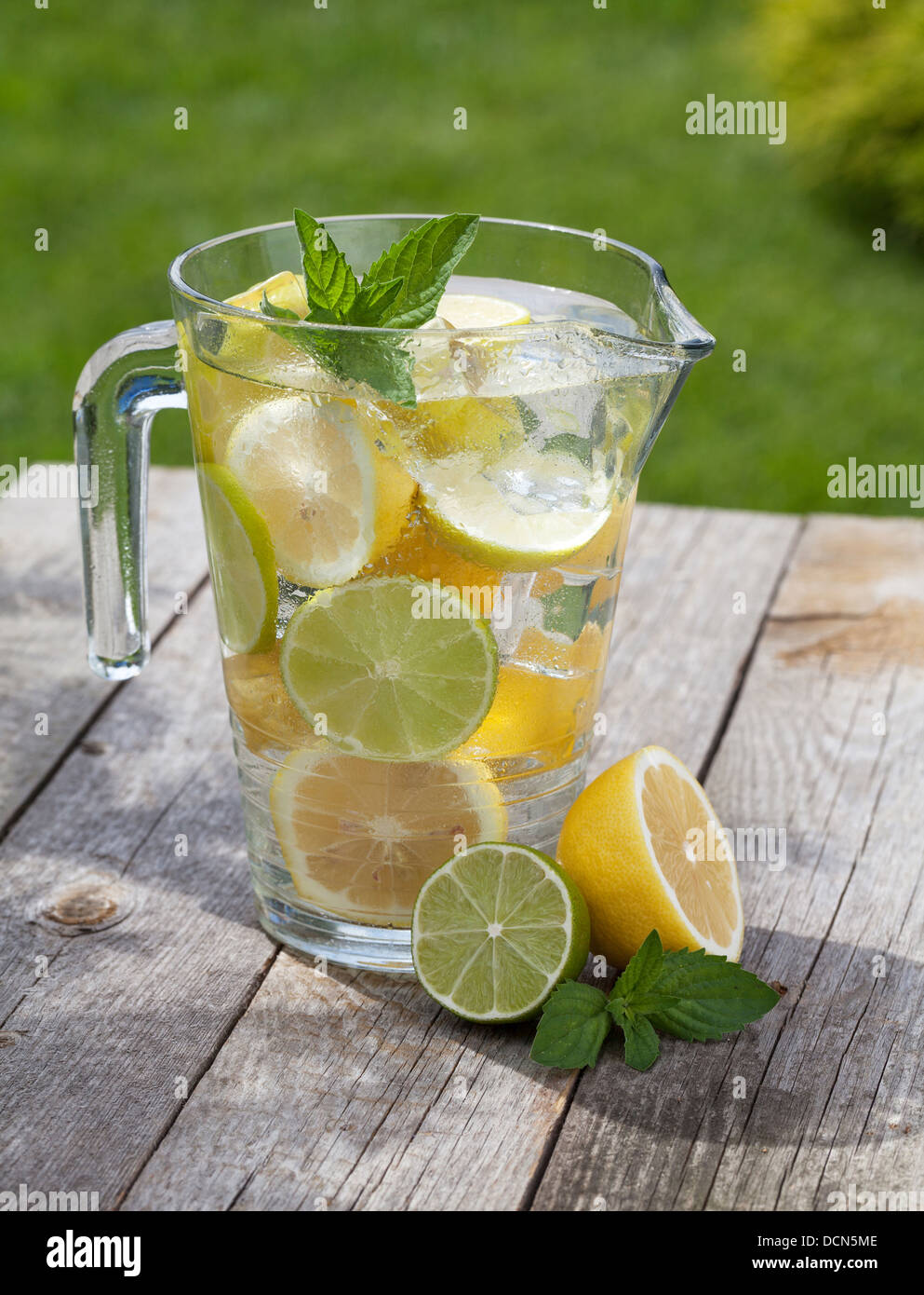 Pitcher with homemade lemonade on wooden table Stock Photo - Alamy