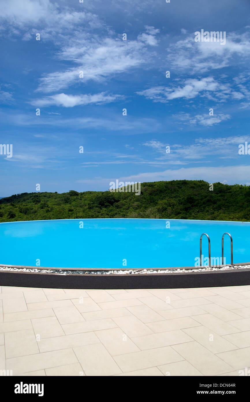 Swimming pool at luxury tropical resort Stock Photo - Alamy