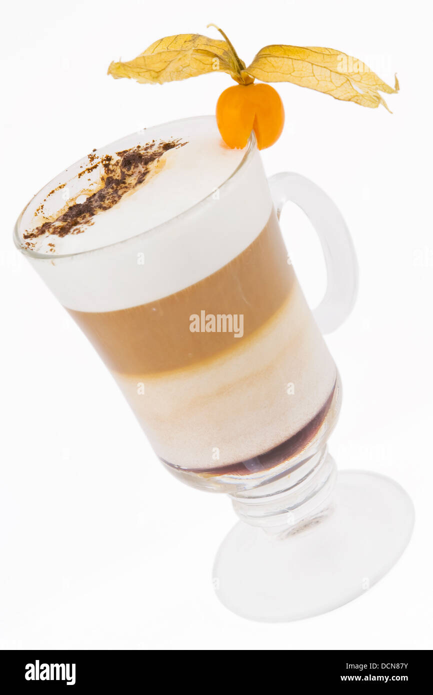A delicious latte in a glass beaker decorated with cape gooseber Stock ...