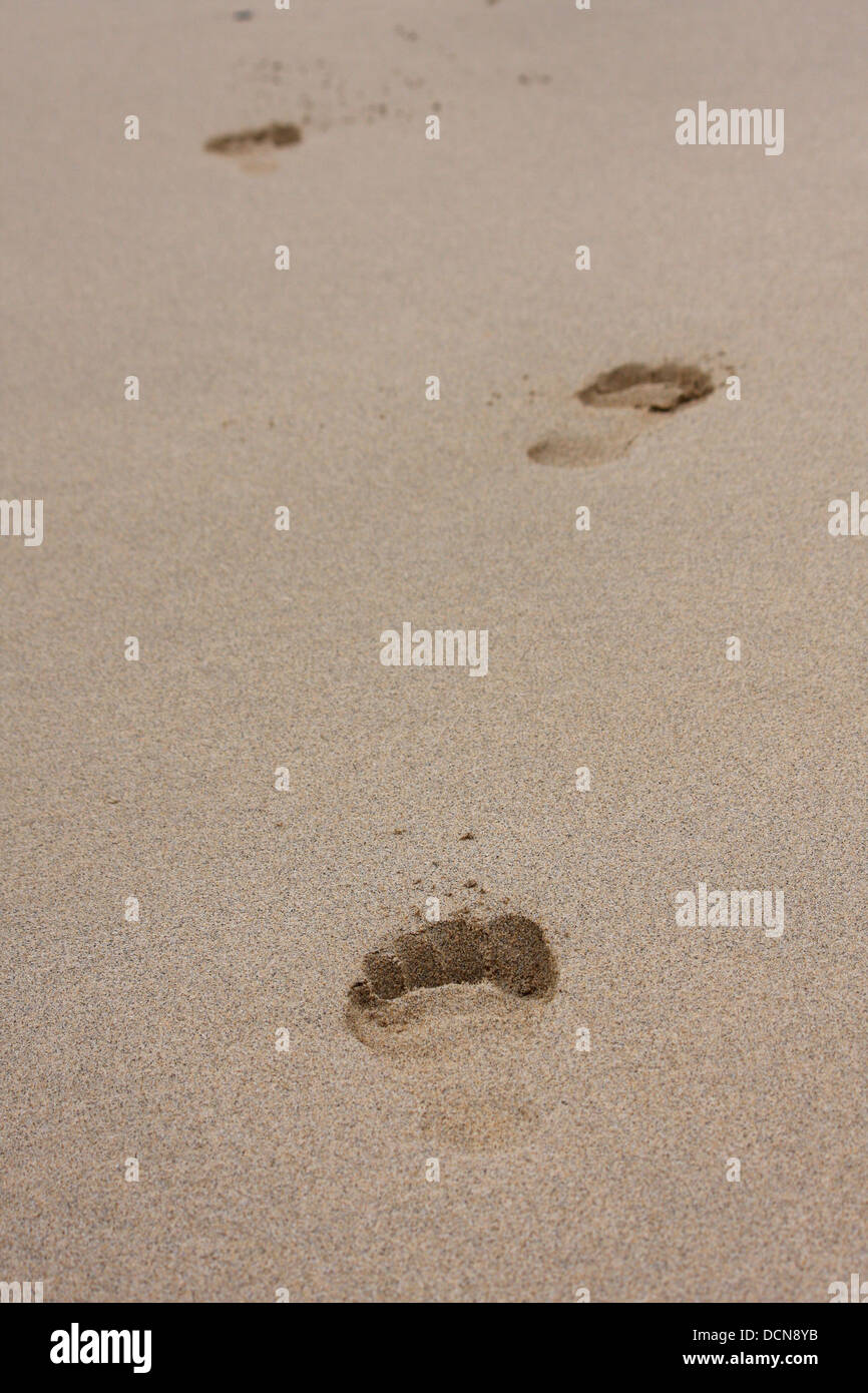 Barefoot steps in sand Stock Photo - Alamy