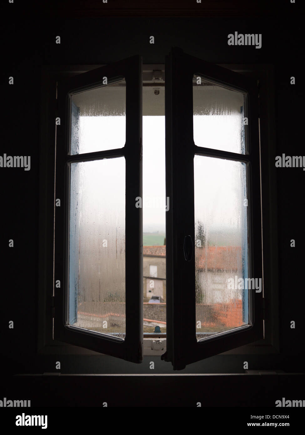 Heavy condensation runs down a window Stock Photo - Alamy