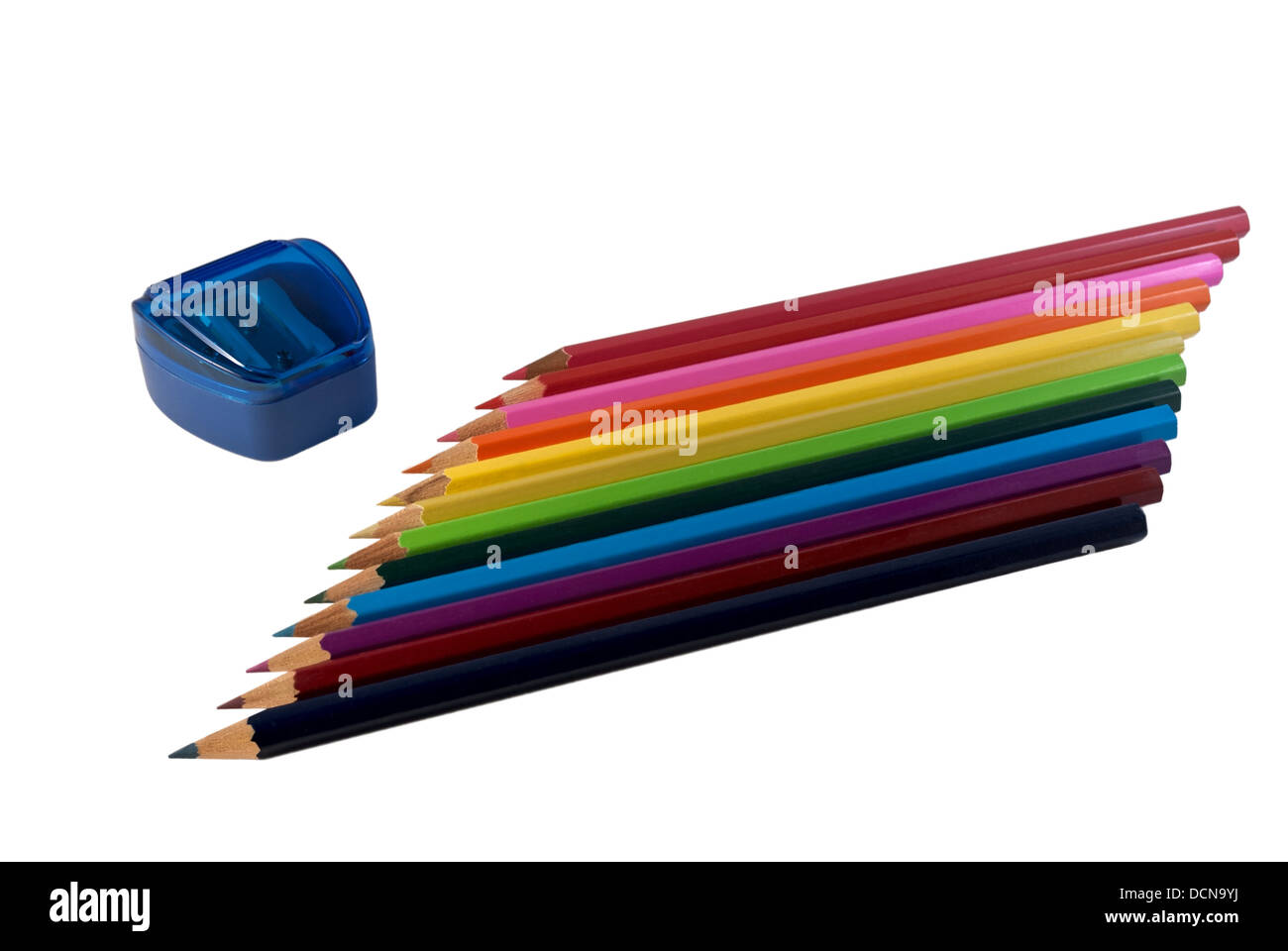 The composition of colored pencils, arranged in a row. Objects are ...