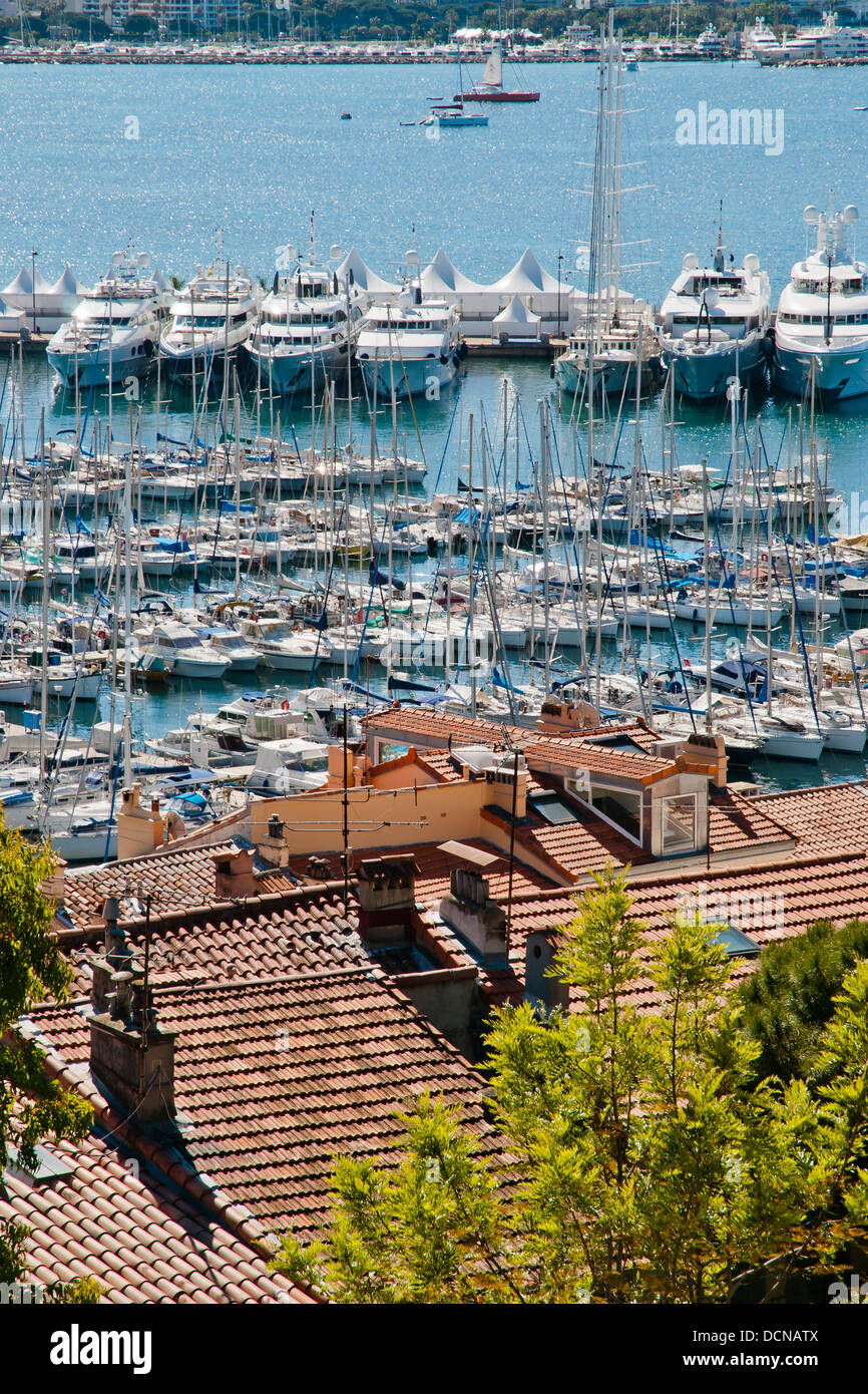 Vertical image of Cannes waterfront with red roofs and yachts, Cannes ...