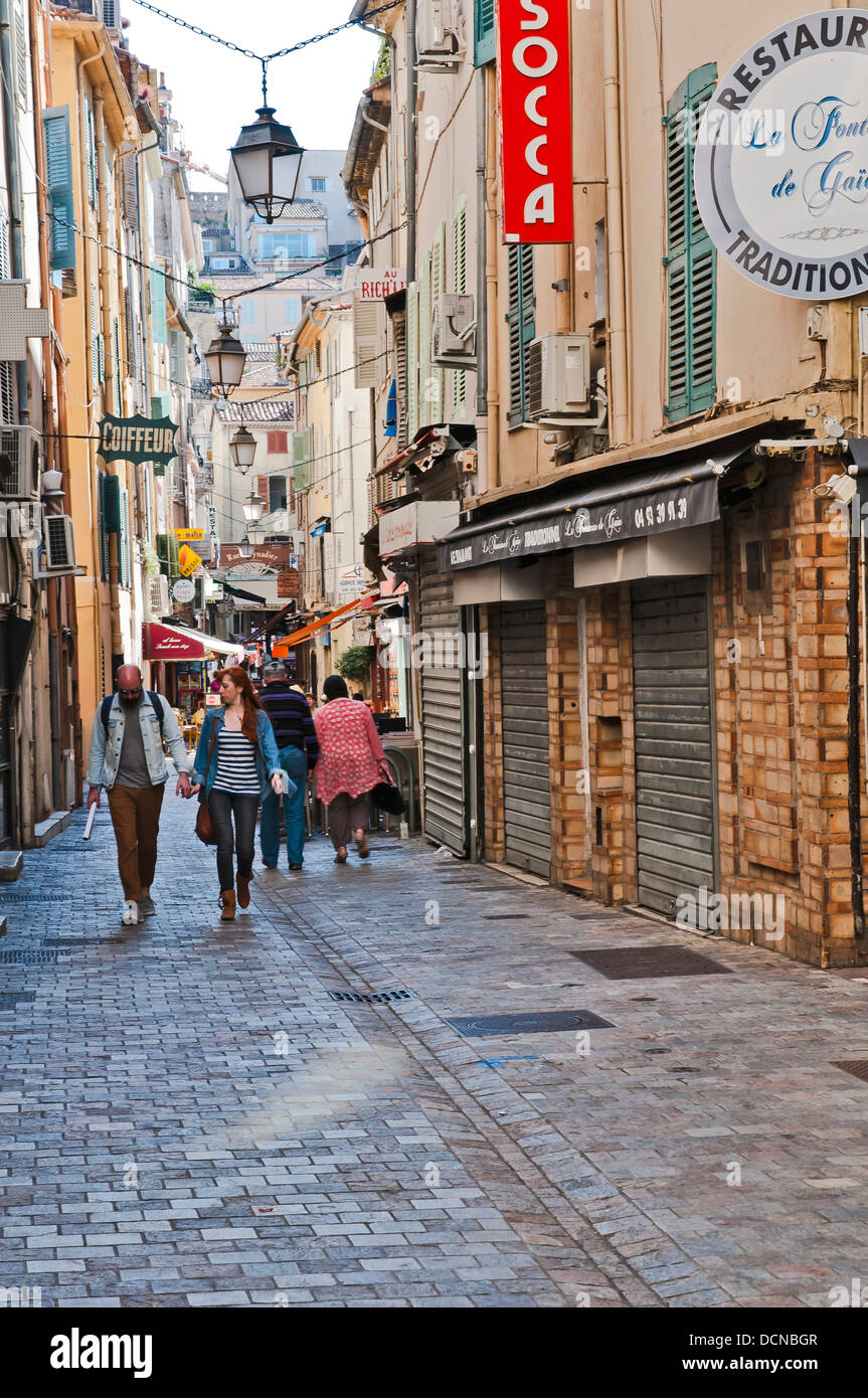 Tourists on the street of old town, Cannes, French Riviera, France ...