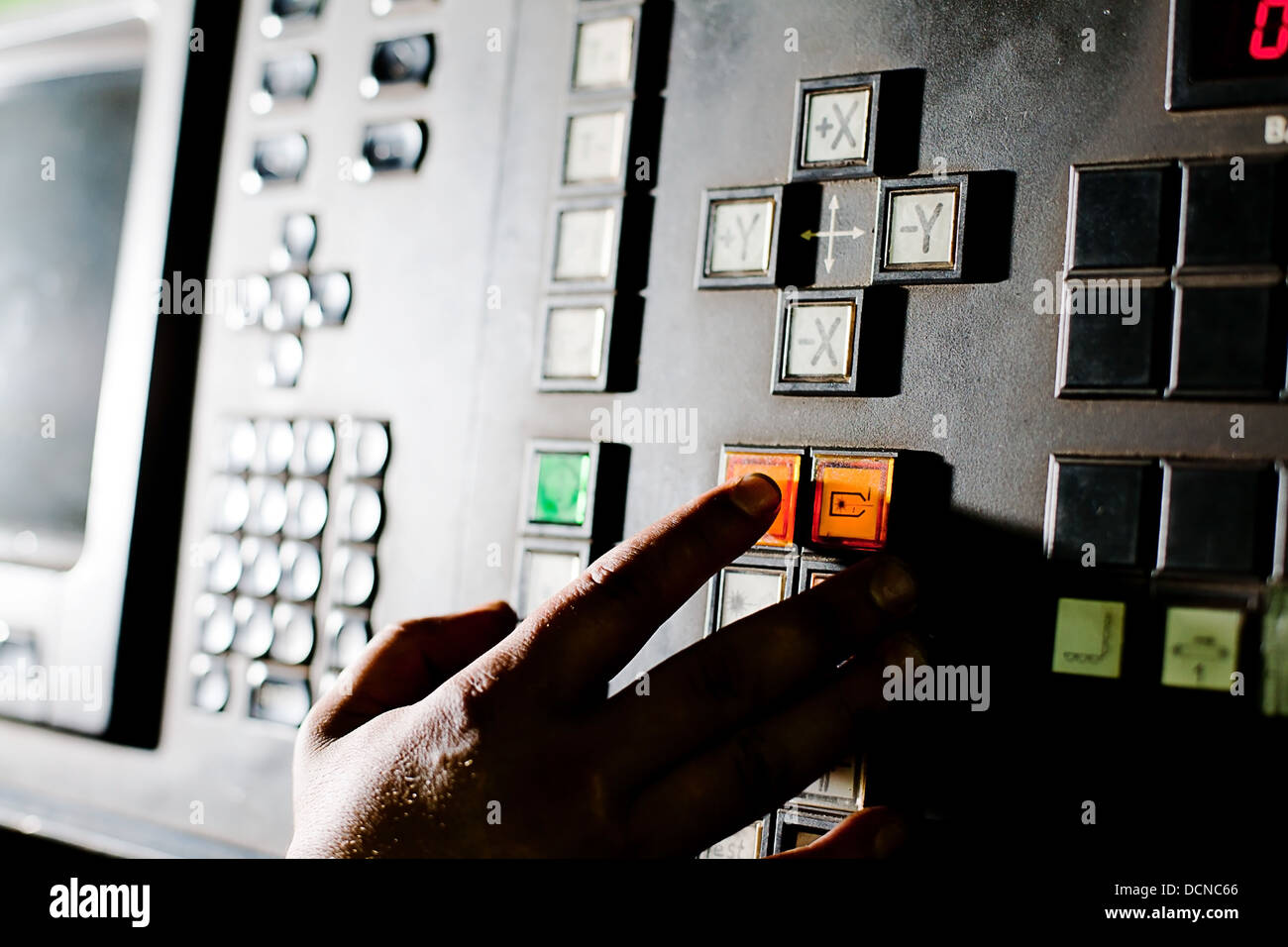 Hand on the button near screen Stock Photo - Alamy