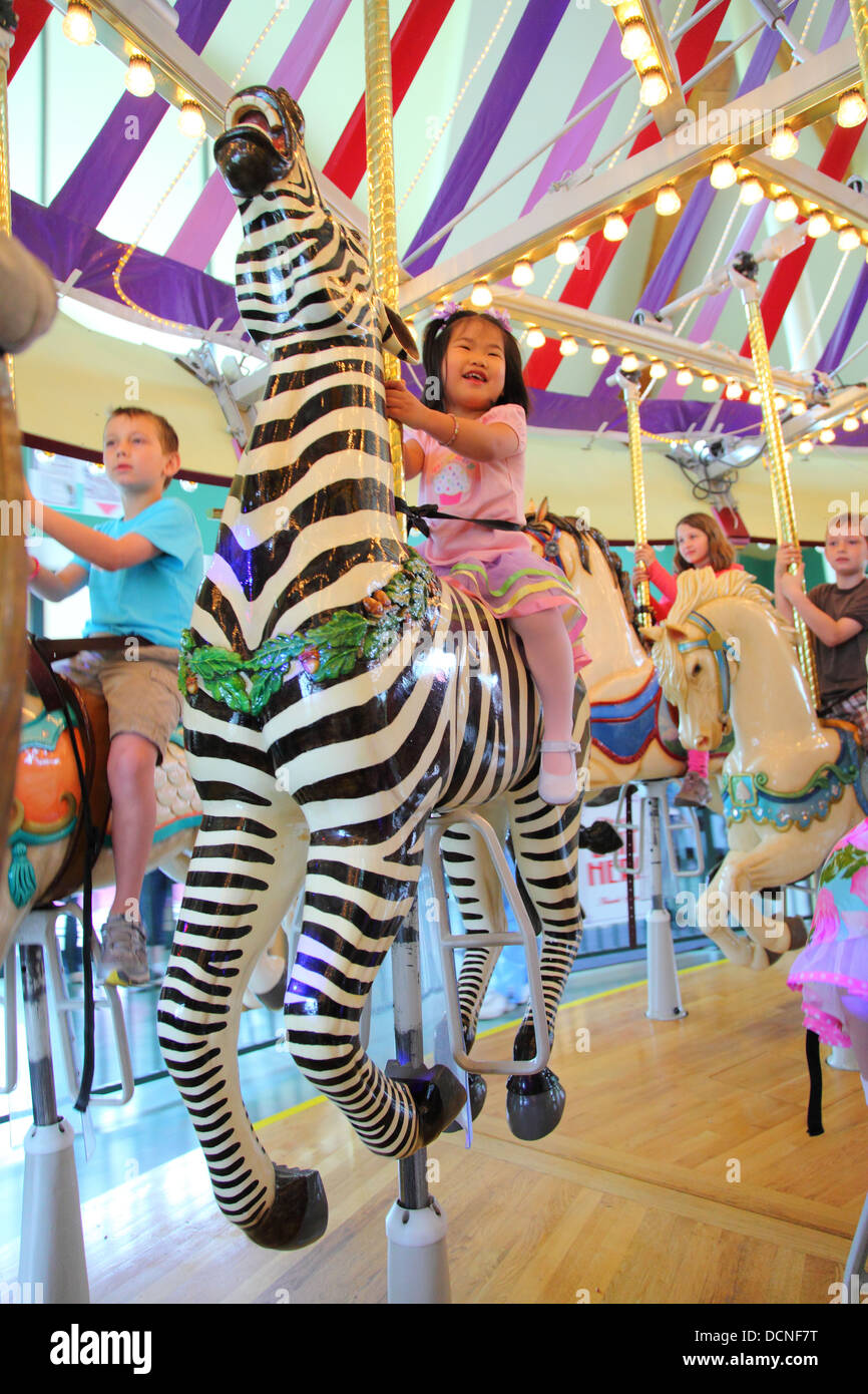Children on carousel Stock Photo - Alamy