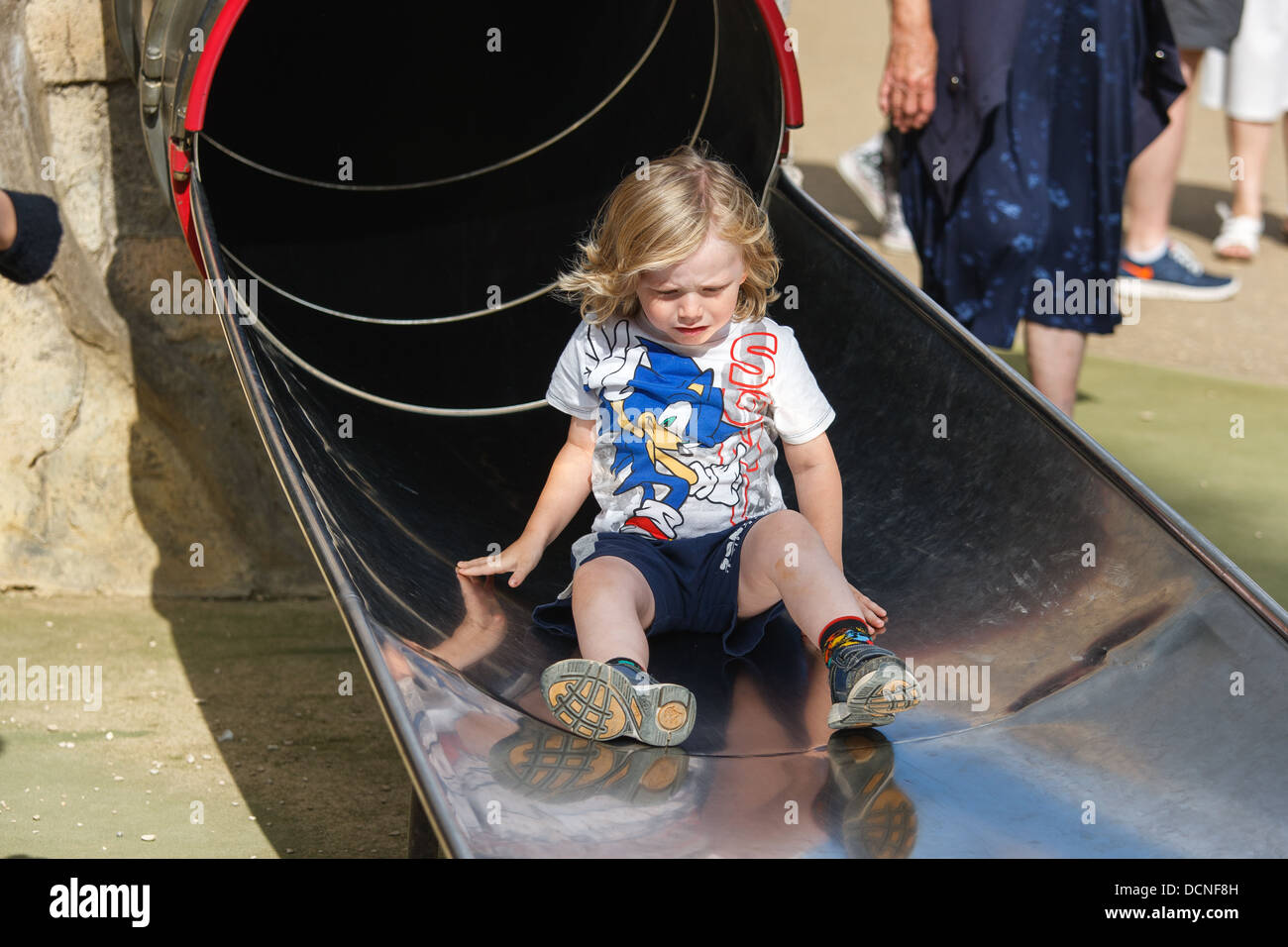 Going down the slide hi-res stock photography and images - Alamy