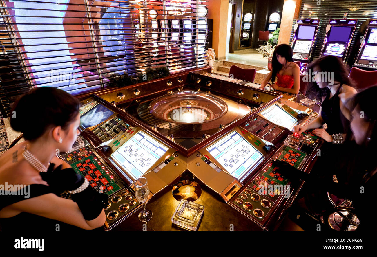 Women playing electric roulette Stock Photo - Alamy