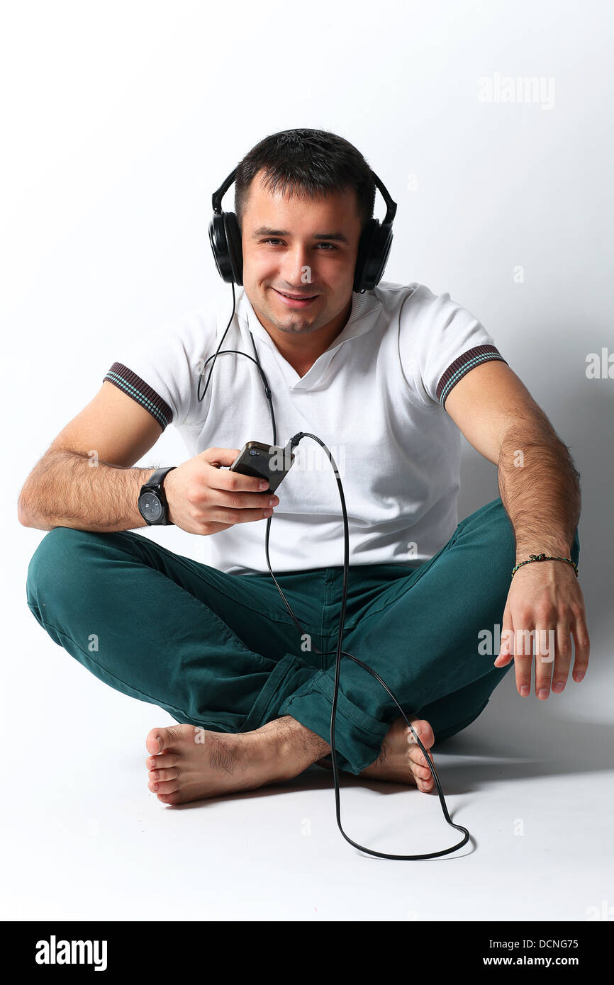 Handsome guy listening music Stock Photo - Alamy