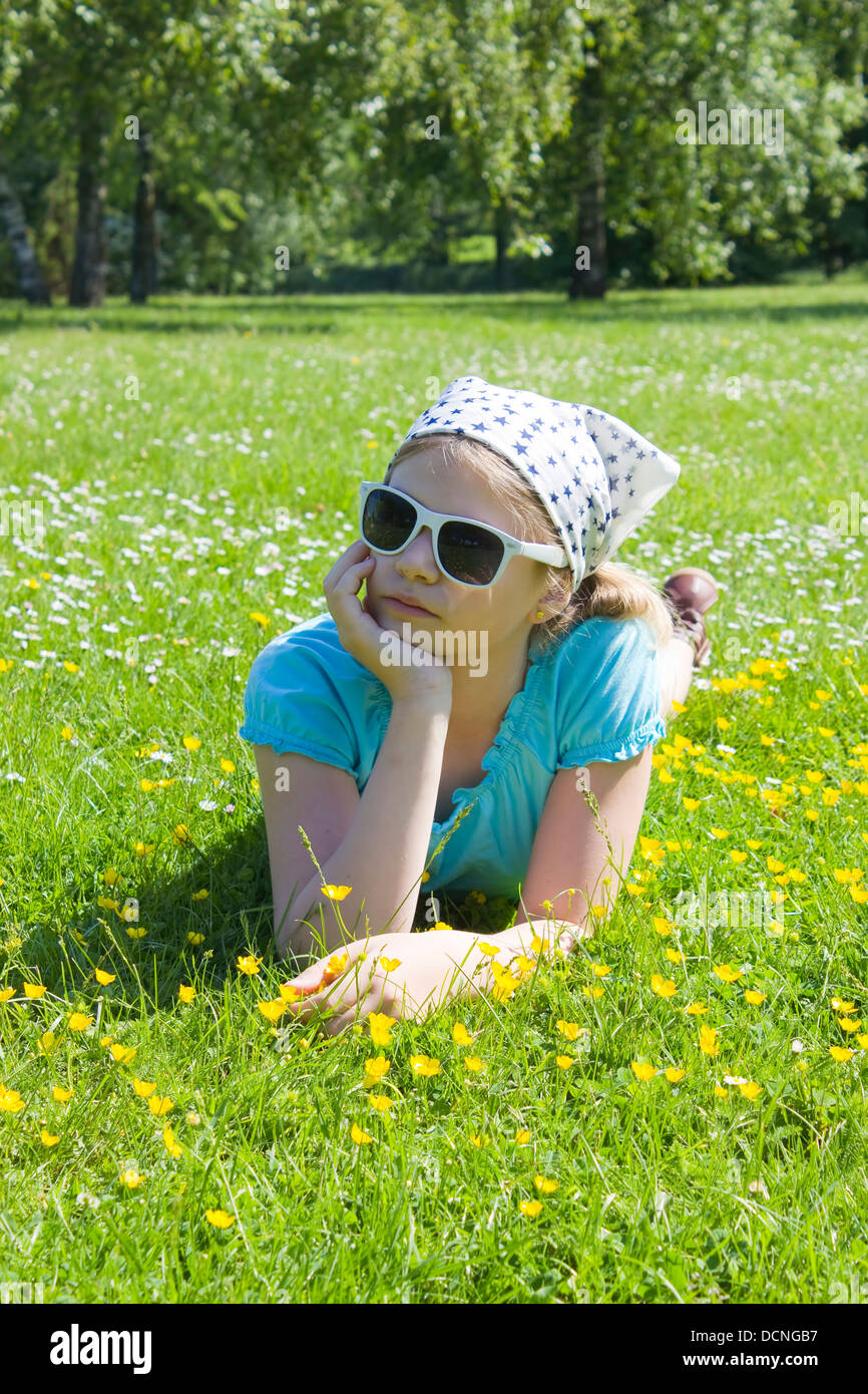 little girl lying on grass Stock Photo - Alamy