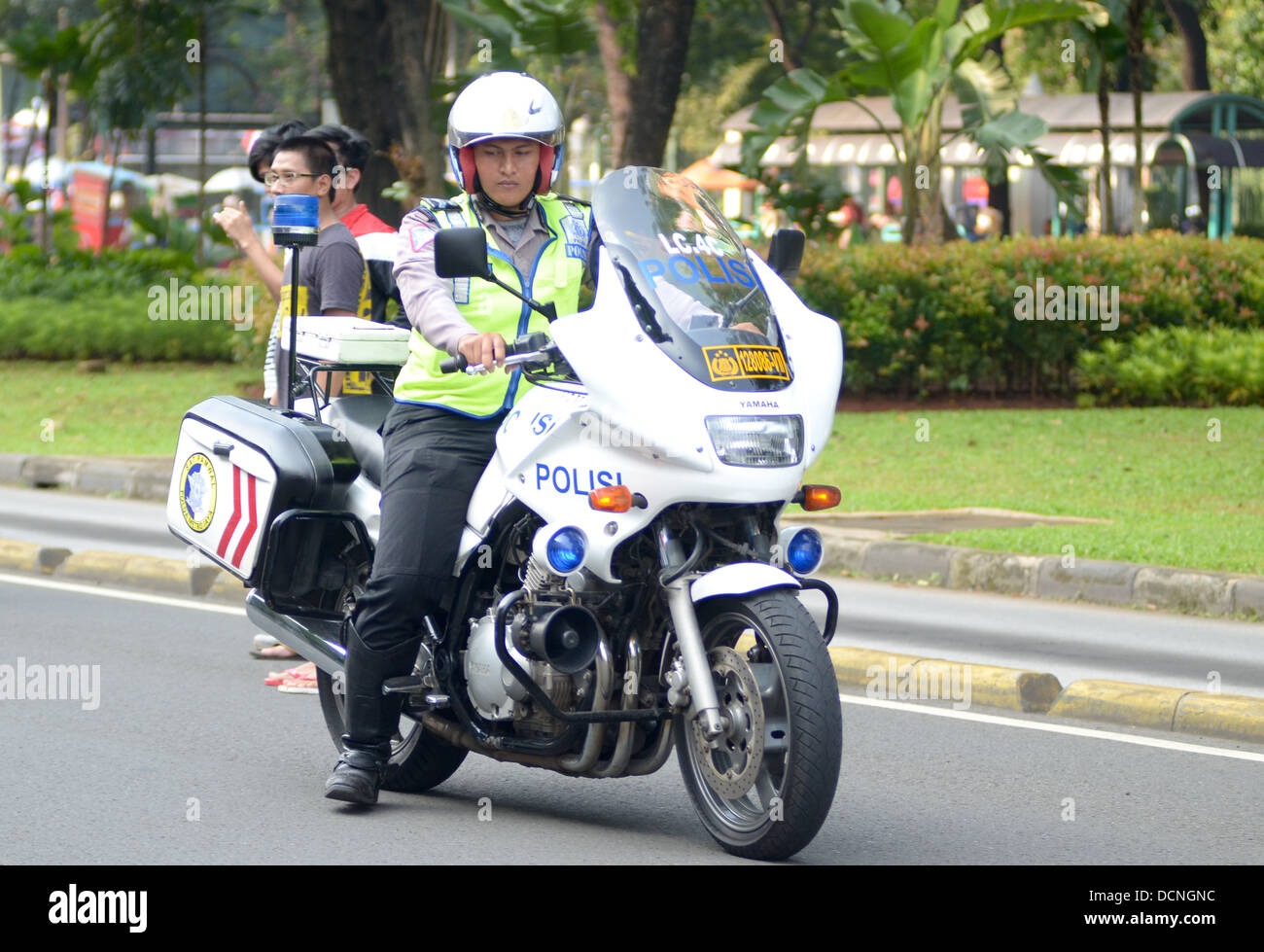 Indonesian police motor patrol Stock Photo - Alamy