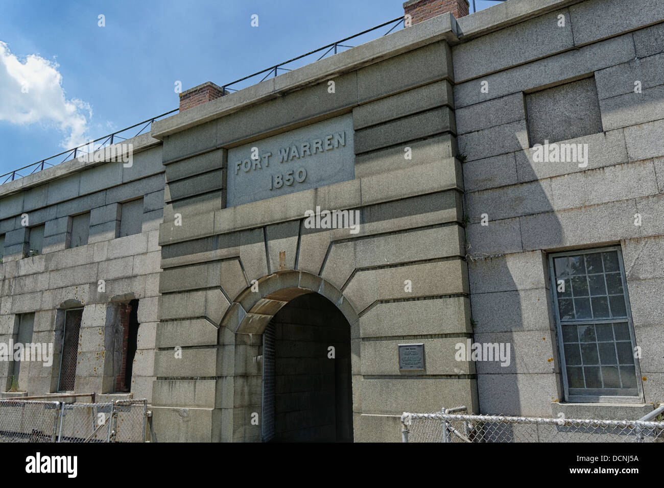Granite sign reading Fort Warren 1850 over fortified entrance doors on ...