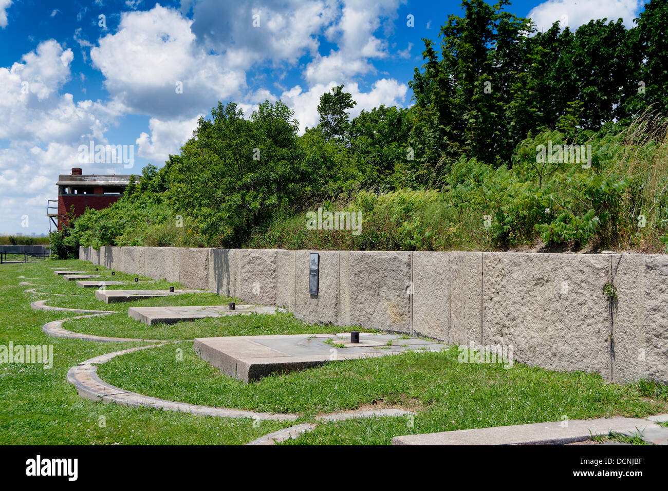Line of abandoned gun emplacements with lookout tower in background at ...