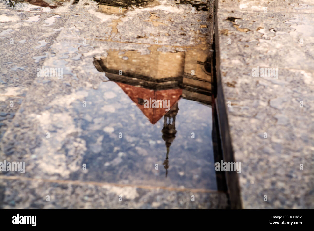 reflection of building in puddle Stock Photo - Alamy