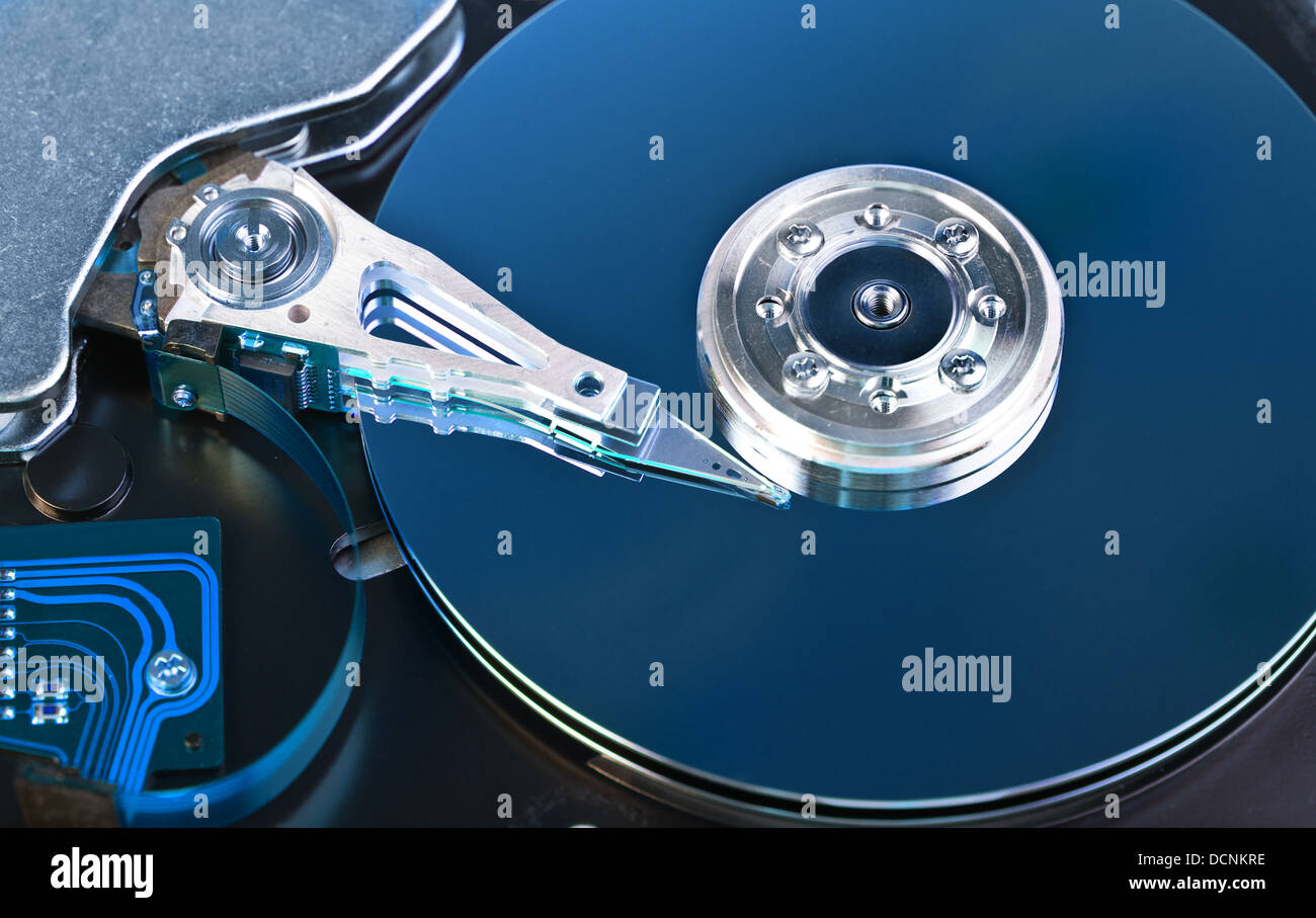 Opened Hard disk drive toned in blue Stock Photo - Alamy