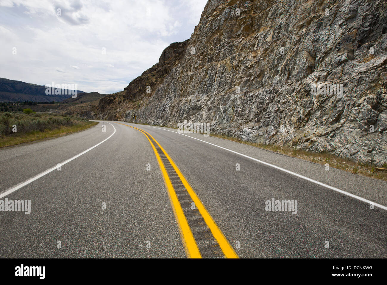 Road going through the mountains Stock Photo - Alamy