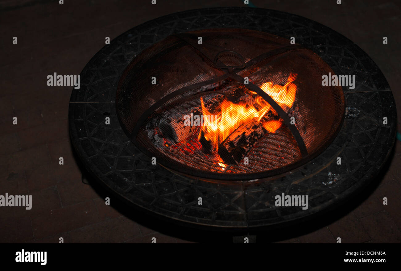 Outdoor fire pit at night Stock Photo - Alamy