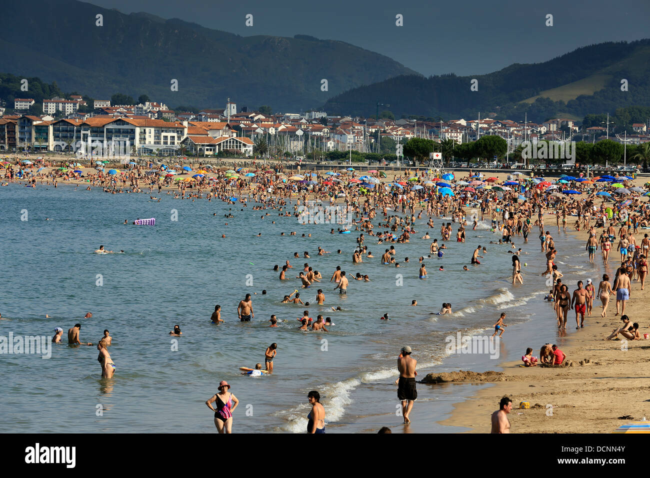 Summertime crowd on Hondarribia beach in the Spanish Basque country ...