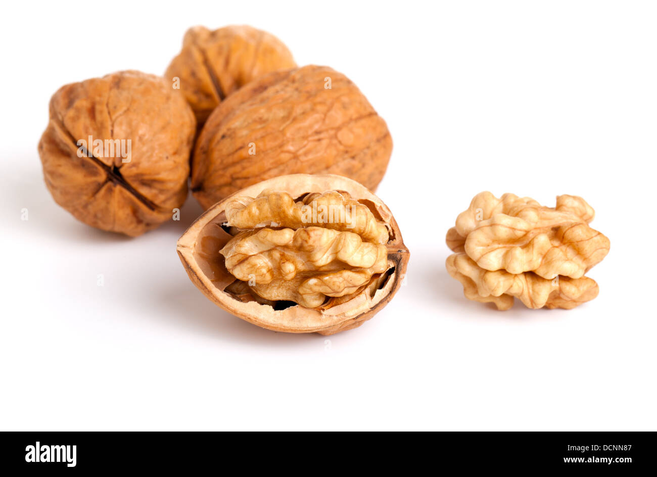 walnut and a cracked walnut isolated on the white background Stock ...