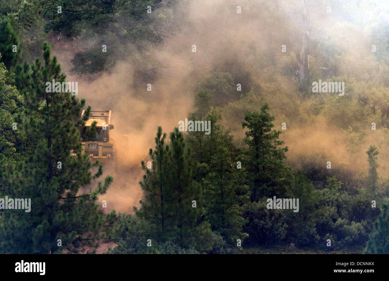 Buck Meadows, CA, USA. 20th Aug, 2013. A bull dozer works to create a ...