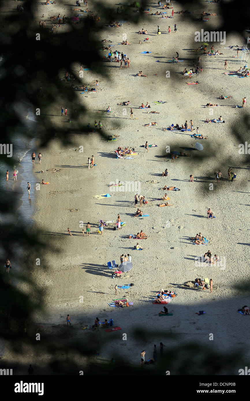 Couple sun bathing beach hi-res stock photography and images - Alamy