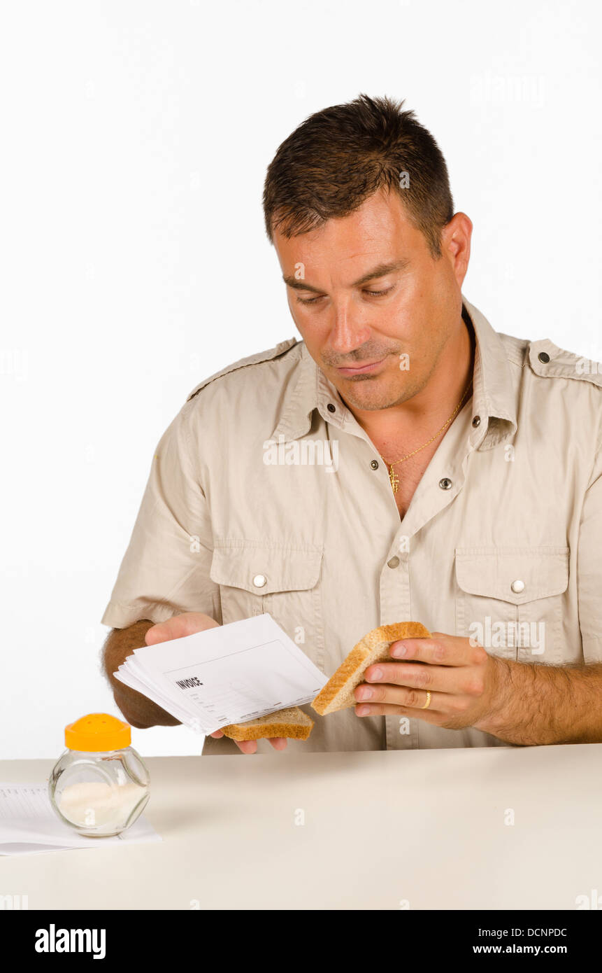 Guy setting up a sandwich stuffed with bills, a financial concept Stock ...