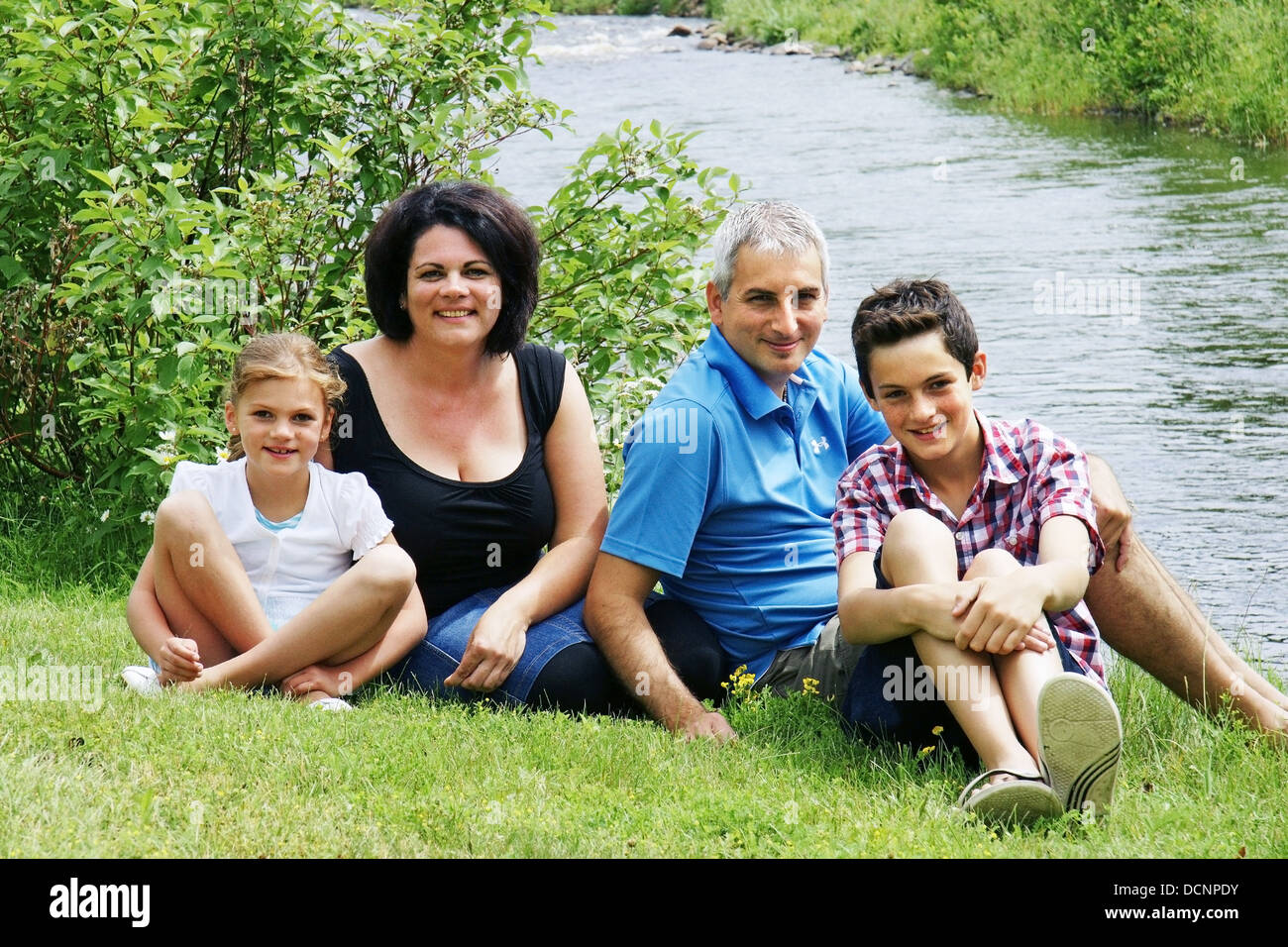 Family by the river Stock Photo - Alamy