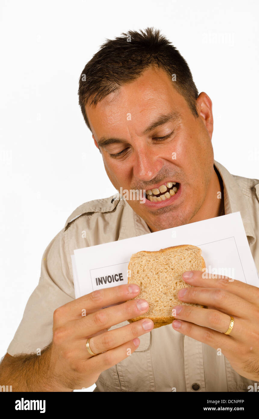 Eating a bill sandwich, a personal finance concept Stock Photo - Alamy