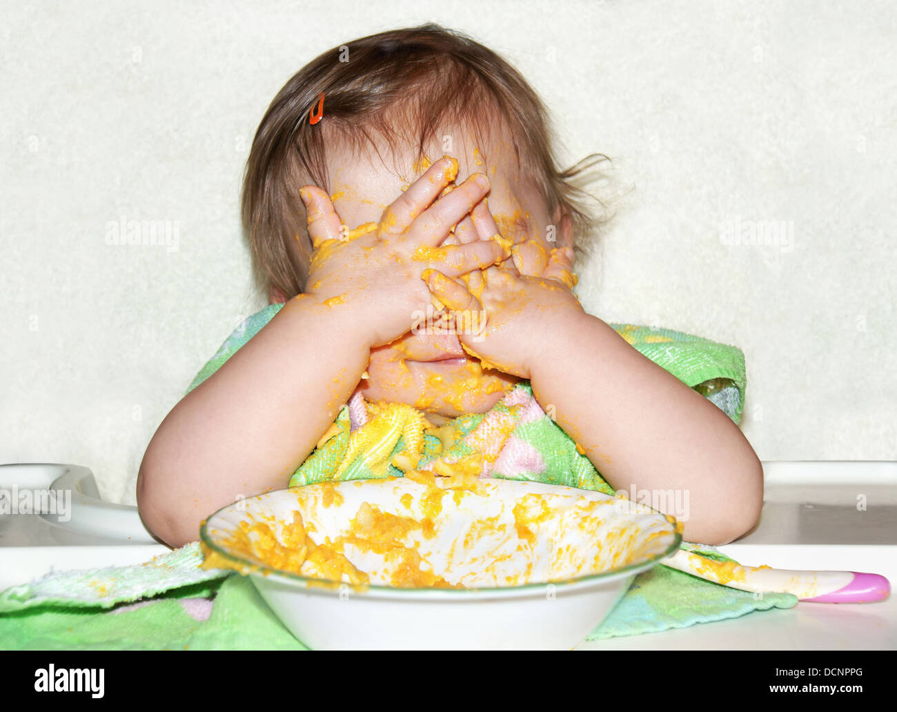 Baby playing picaboo at the wrong time Stock Photo - Alamy