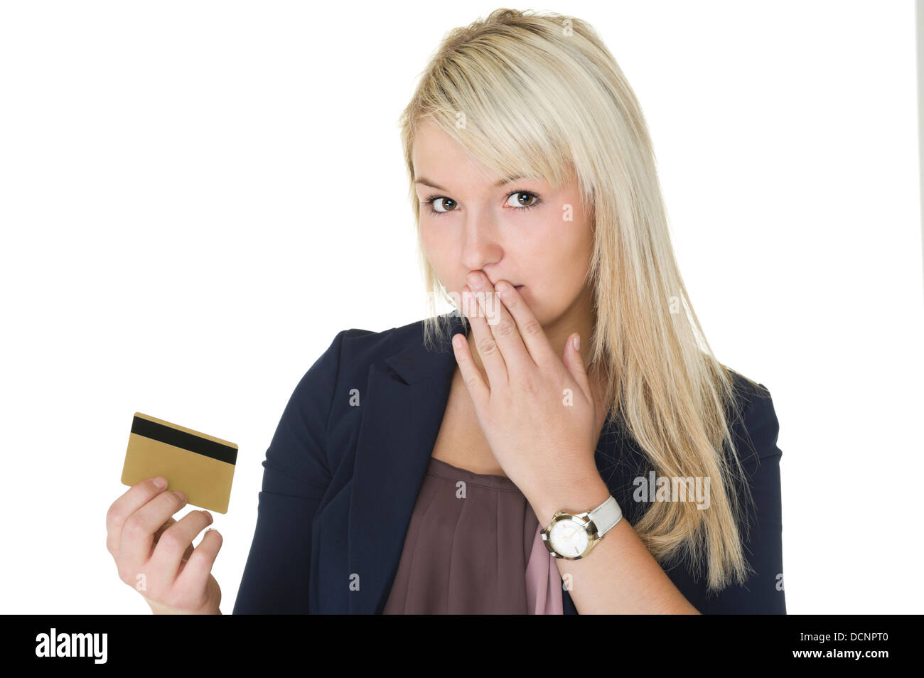 Woman with guilty look holding credit card Stock Photo - Alamy