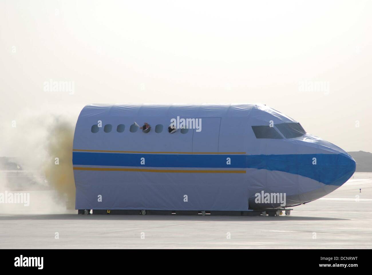 PLANE SPLITS IN TWO. . .BUT IT'S ONLY A DRILL! An airliner's fuselage ...