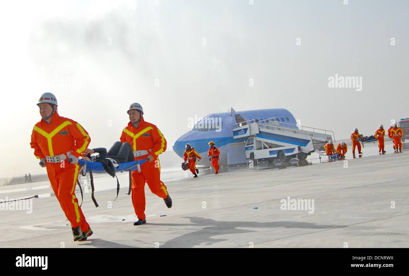 PLANE SPLITS IN TWO. . .BUT IT'S ONLY A DRILL! An airliner's fuselage ...